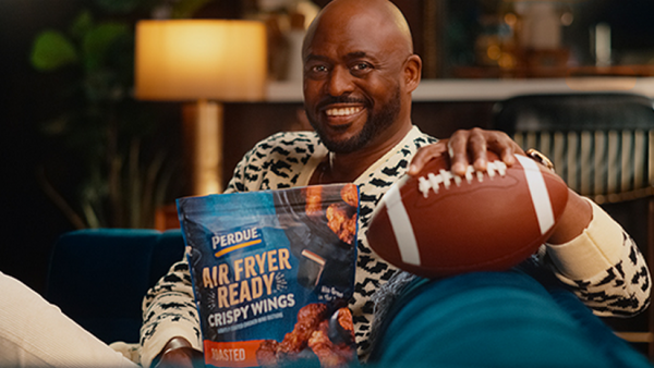 PERDUE is 'winging it' with Wayne Brady during this year's big game ...